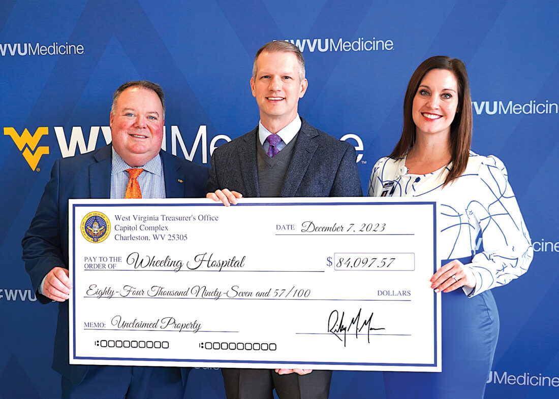 Moore turns $84K unclaimed property check over to hospital | News ...